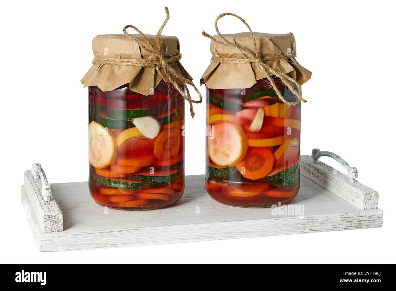 two jars with salted fermented vegetables decorated with craft paper ...