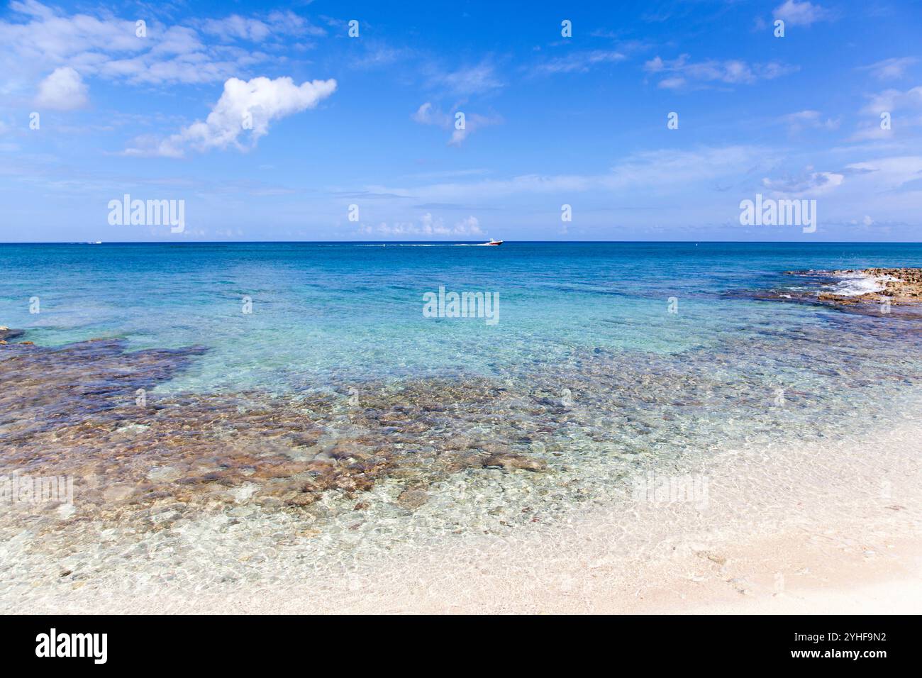 The scenic view of colorful Seven Mile Beach waters on Grand Cayman ...