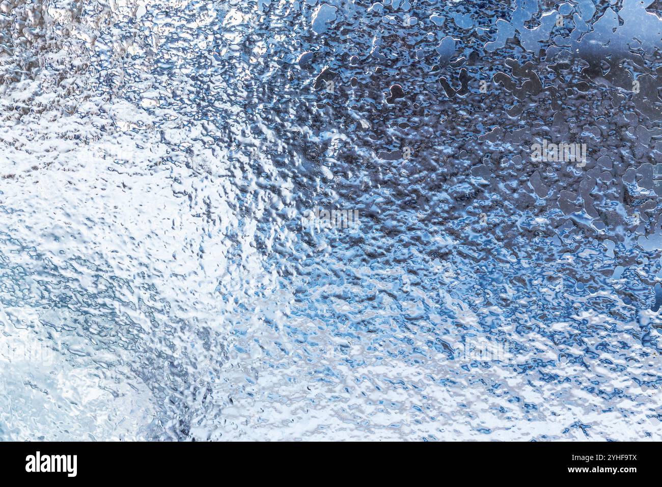 Frozen ice pattern on glass Stock Photo - Alamy