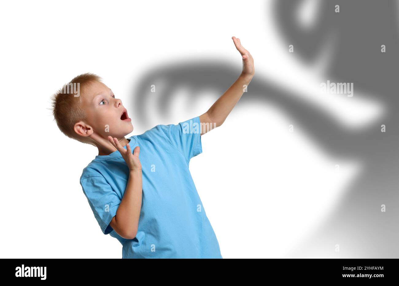Boy scared of monsters, teraphobia. Creepy shadow attacking him Stock ...