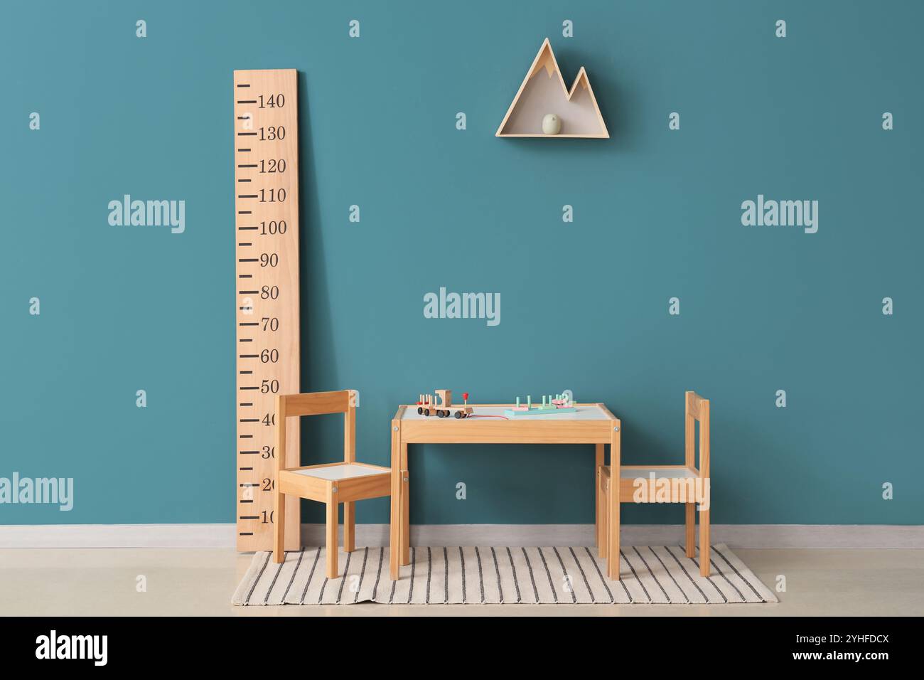 Interior of children's room with table, chairs and stadiometer Stock ...