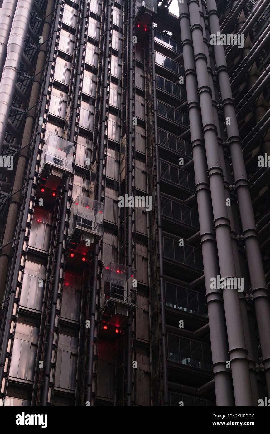 4 elevators on the outside of the Lloyd's building in London Stock ...