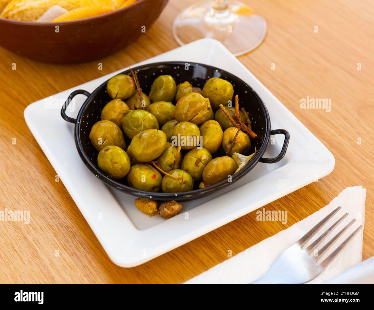 Pickled olives with a stone - a typical Spanish tapas Stock Photo - Alamy