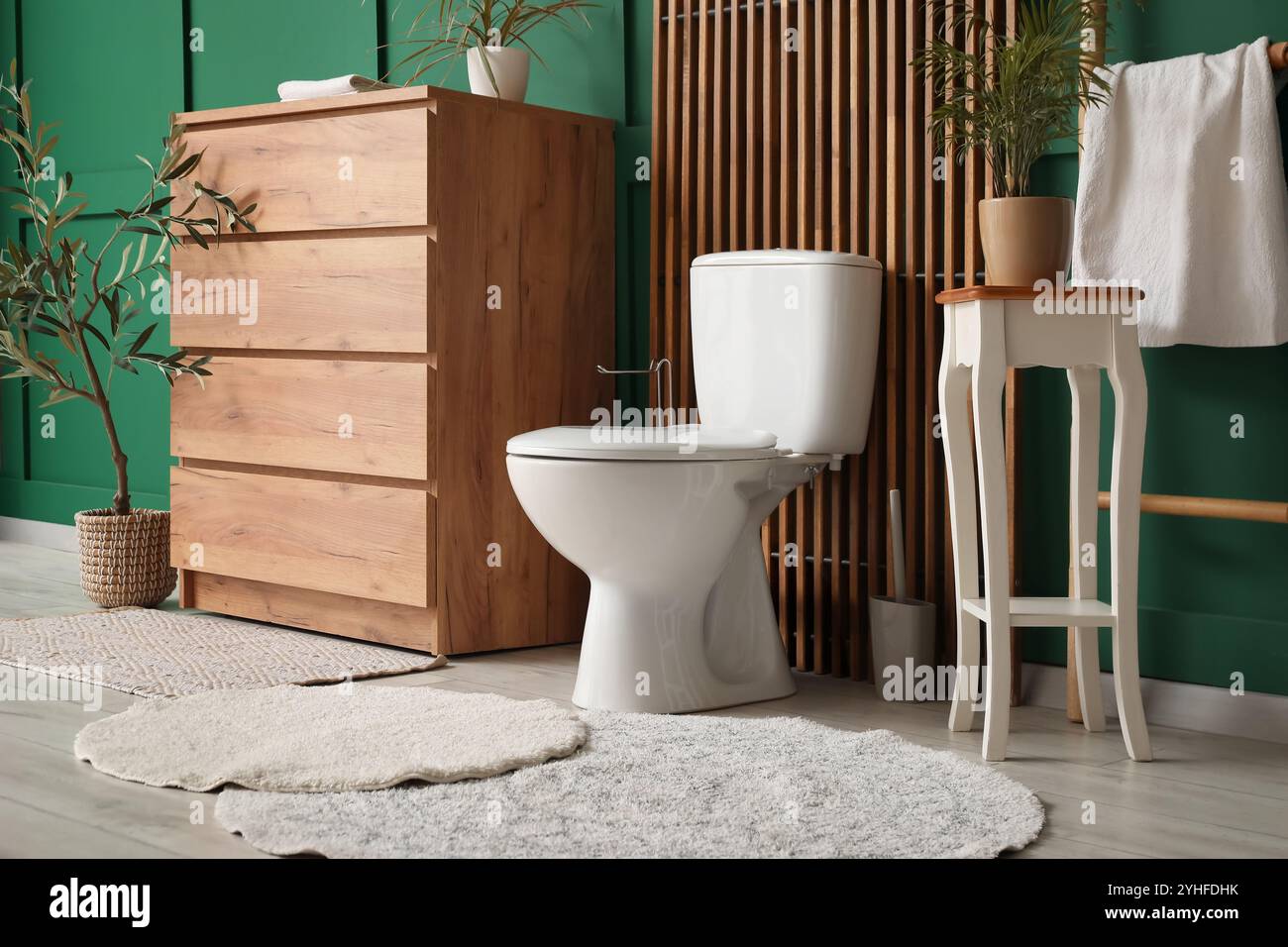 Interior of restroom with toilet bowl, commode and table Stock Photo ...