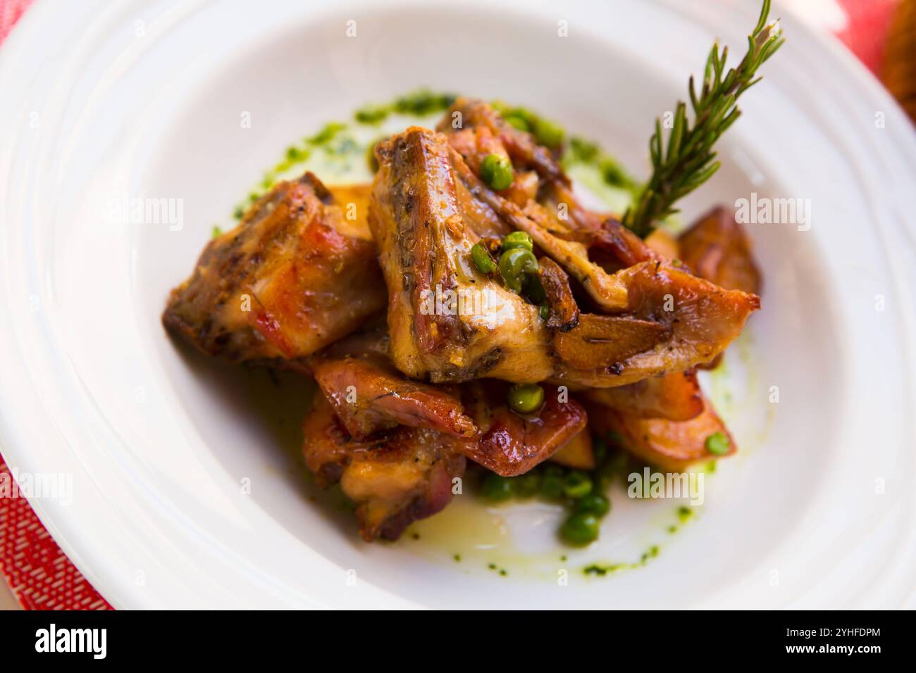 Baked rabbit meat with garlic Stock Photo - Alamy
