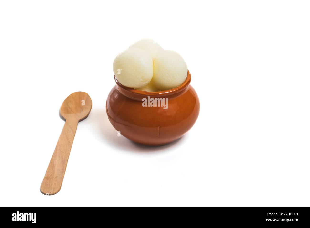 A traditional Indian dessert, Rasgulla, served in a rustic clay pot ...