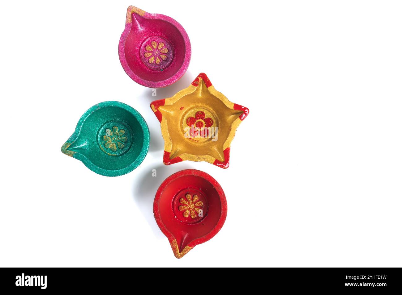 Brightly colored diya on a white background, representing the Diwali ...