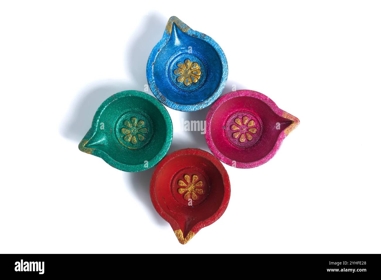 Brightly colored diya on a white background, representing the Diwali ...