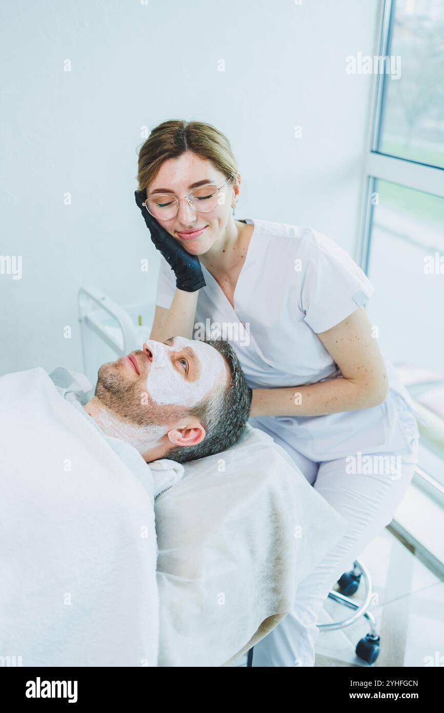 The man is at the dermatologist's appointment. Male cosmetology. Masks ...