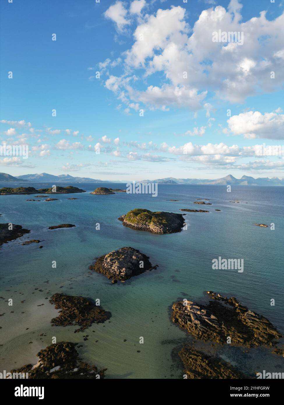 Vertical Drone Shot, Half sea ocean with islands, half sky with light ...
