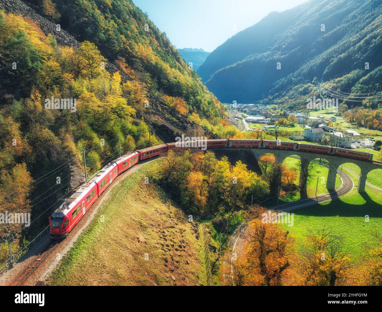 Aerial view of red train on Kreisviadukt Brusio in mountains Stock ...
