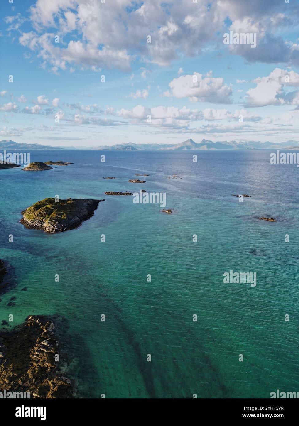 Vertical Drone Shot, Half sea ocean with islands, half sky with light ...