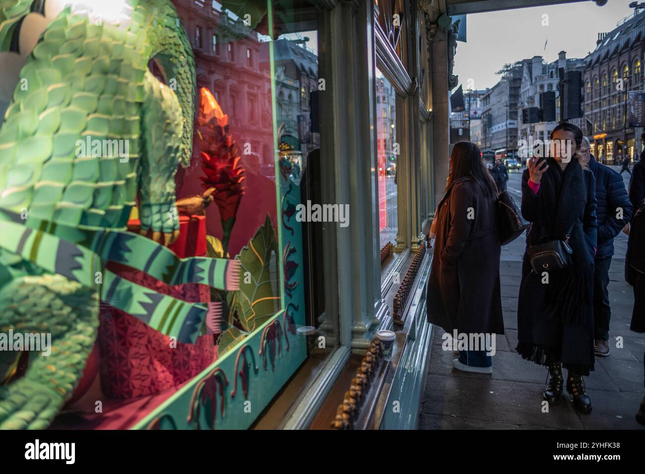 Tourists congregate around the Fortnum & Mason Christmas 2024 window display, situated on ...