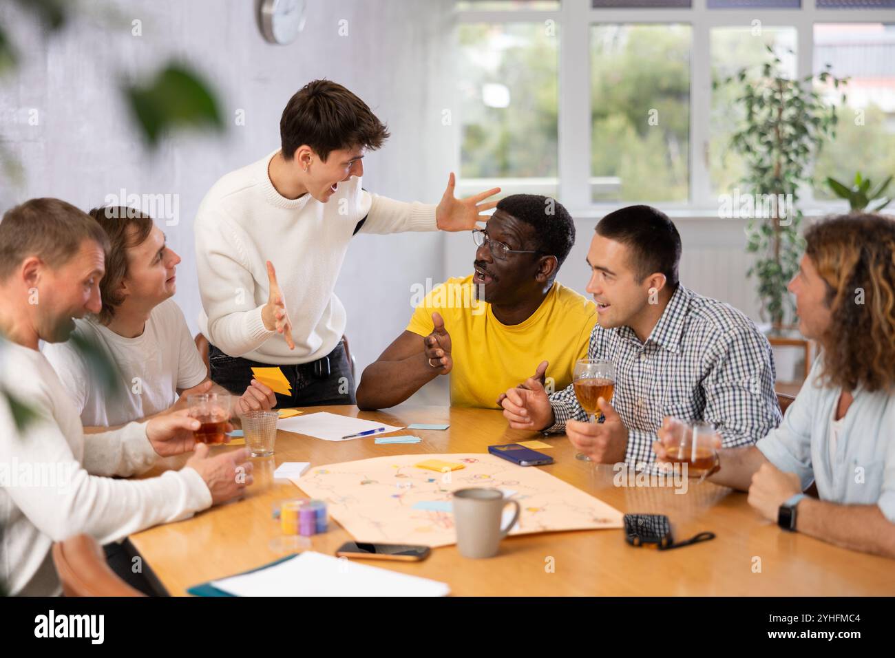 Cheerful guy playing board hi-res stock photography and images - Alamy