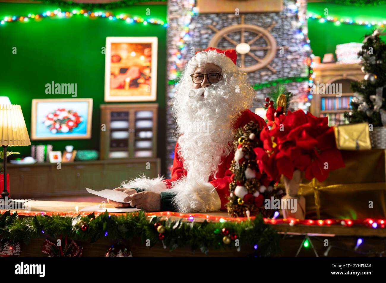 Happy santa claus reading letters hi-res stock photography and images ...