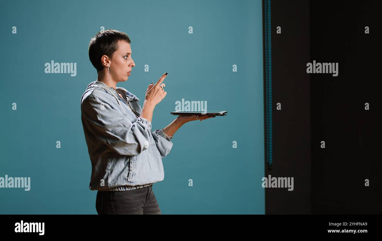 Modern tech person operating on tablet with a futuristic hologram ...