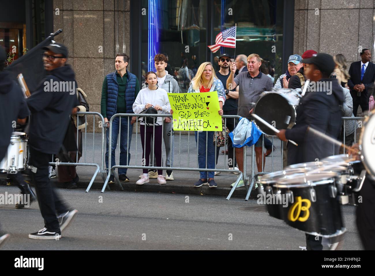 People hold up signs as veterans march up 5th Avenue in the 2024 NYC ...