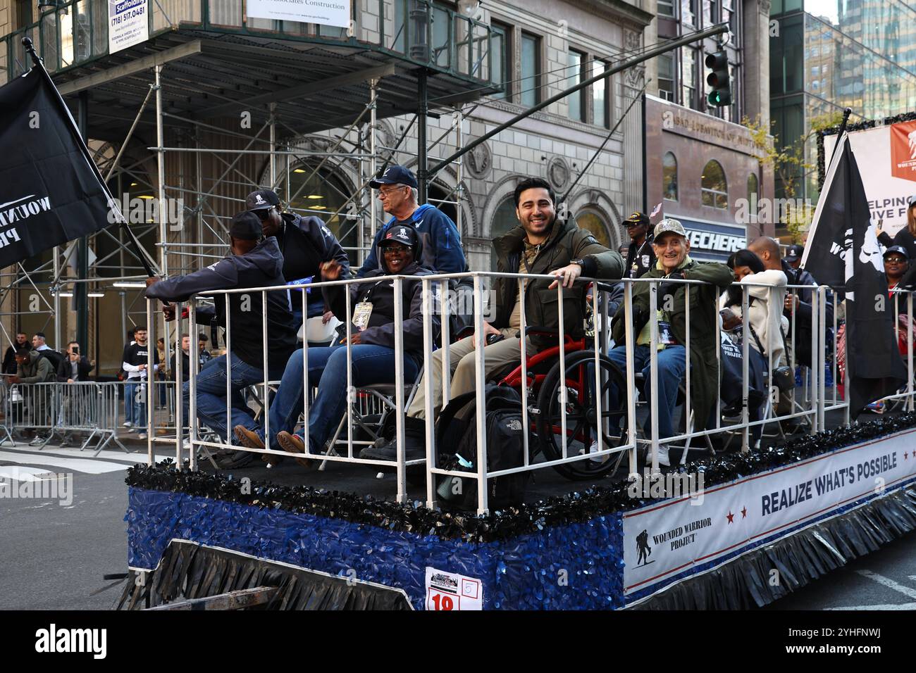 Veterans ride a float for the Wounded Warrior Project march up 5th Avenue in the 2024 NYC ...