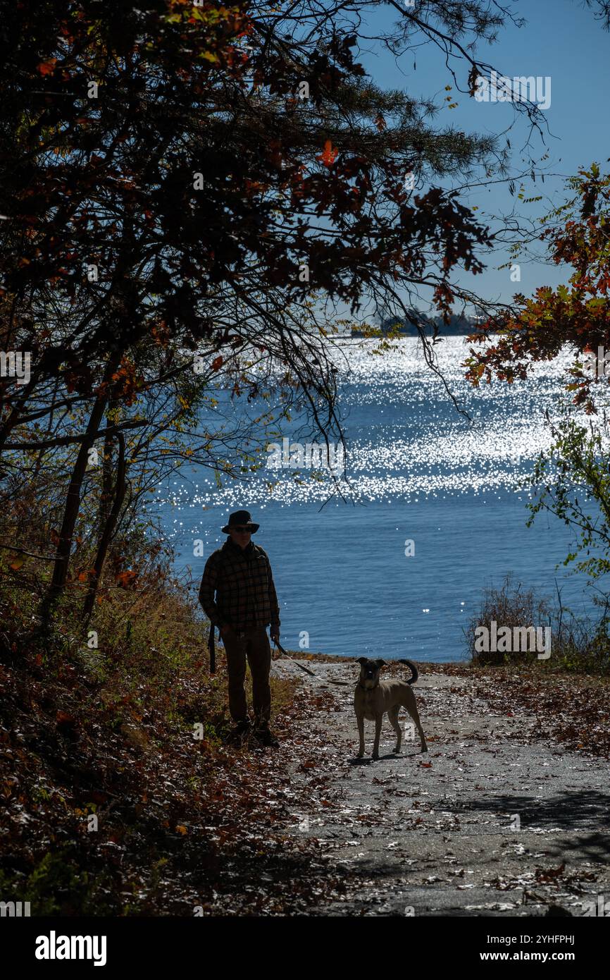 Park visitors walk on a path toward the Dog Beach at Wuiet Waters Park ...
