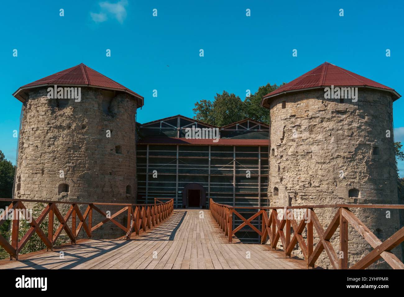 A grand entrance to an ancient fortress, featuring twin stone towers ...