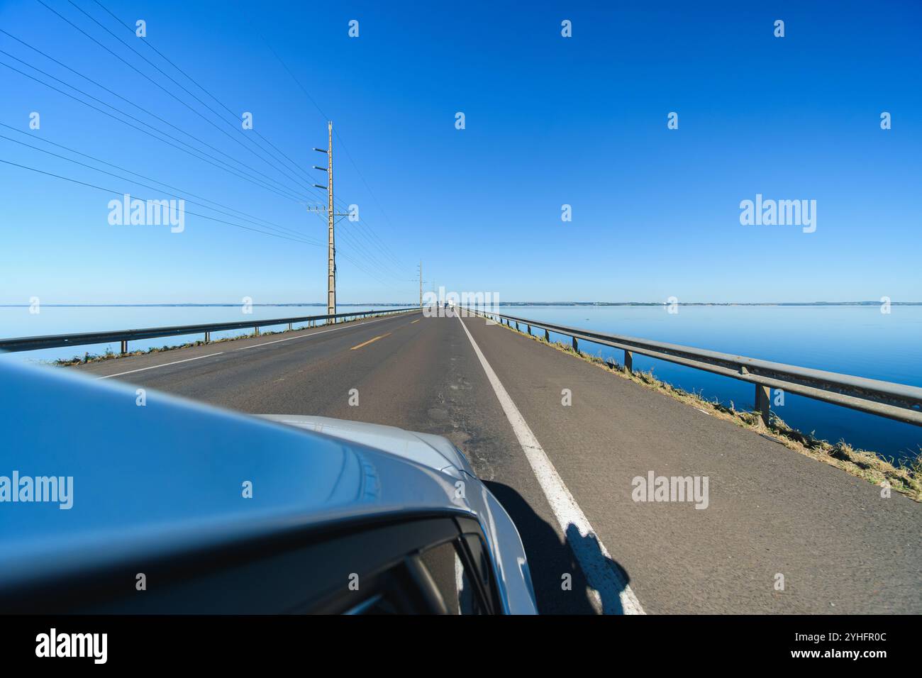 Driving the car on the Helio Serejo bridge, over the Parana river, on ...