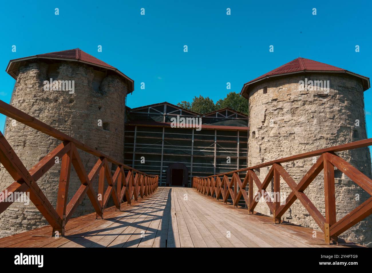 A grand entrance to an ancient fortress, featuring twin stone towers ...
