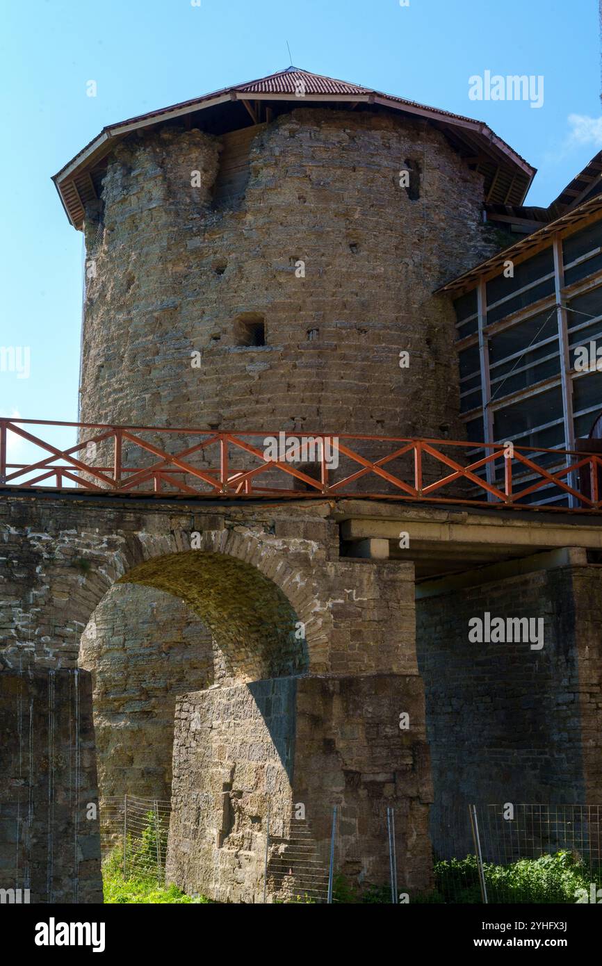 Close-up of a historic fortress with stone archways and a wooden ...