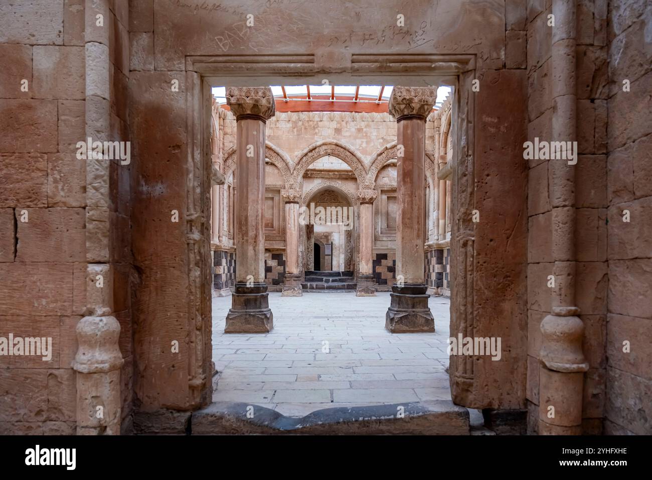 The inside of a building with arched windows and pillars. The building ...