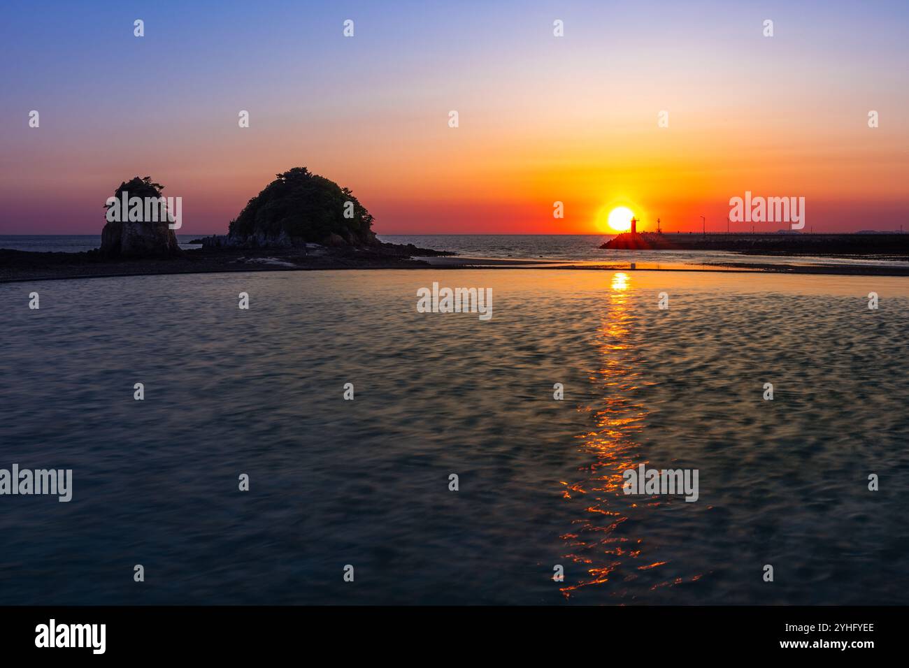 Beautiful sunset over the sea. Grandmother and Grandfather Rocks at ...