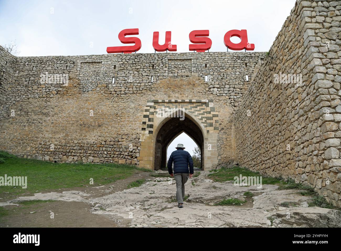Tourist walking towards the Ganja Gate of Shusha Fortress in the ...