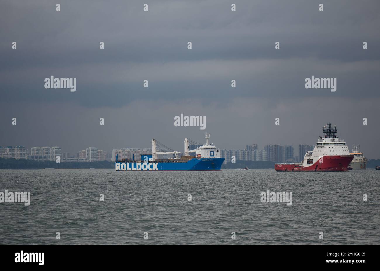 The Heavy Load Carrier Rolldock Star sits anchored off Singapore in the ...