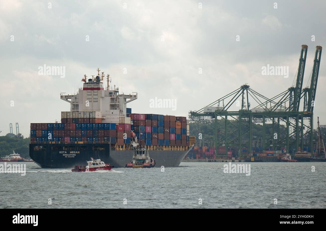 KOTA MEGAH container ship sails into Singapore port with the Singapore ...