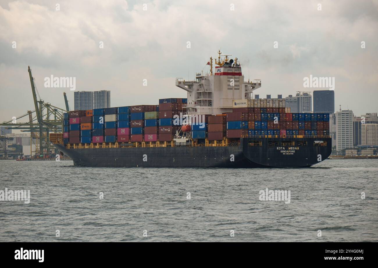KOTA MEGAH container ship sails into Singapore port with the Singapore ...