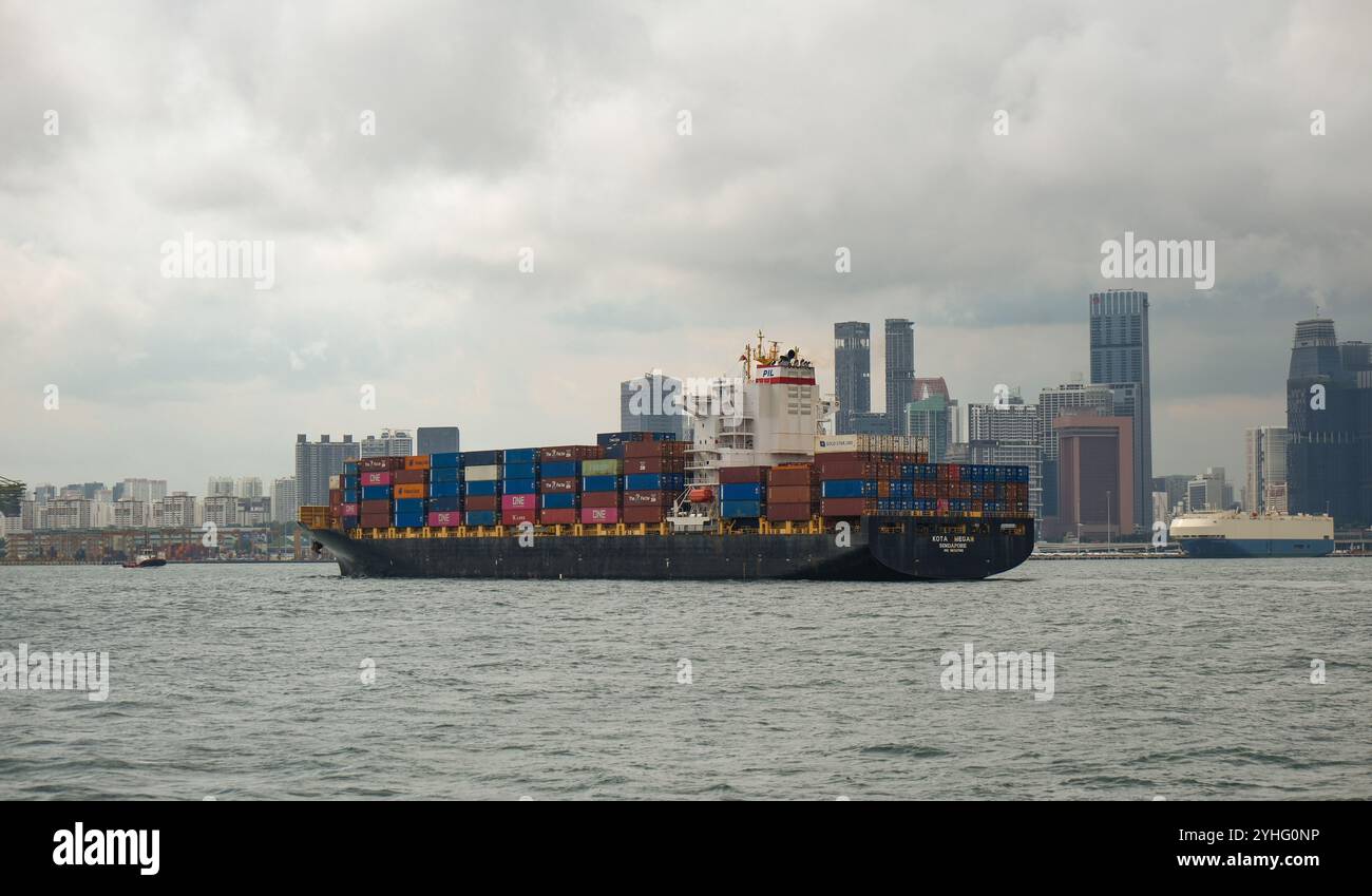 KOTA MEGAH container ship sails into Singapore port with the Singapore ...