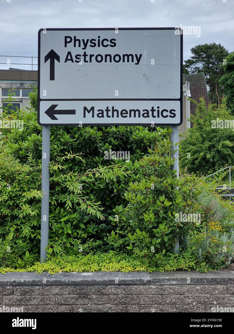 Sign with texts Physics Astronomy and Mathematics pointing in different ...