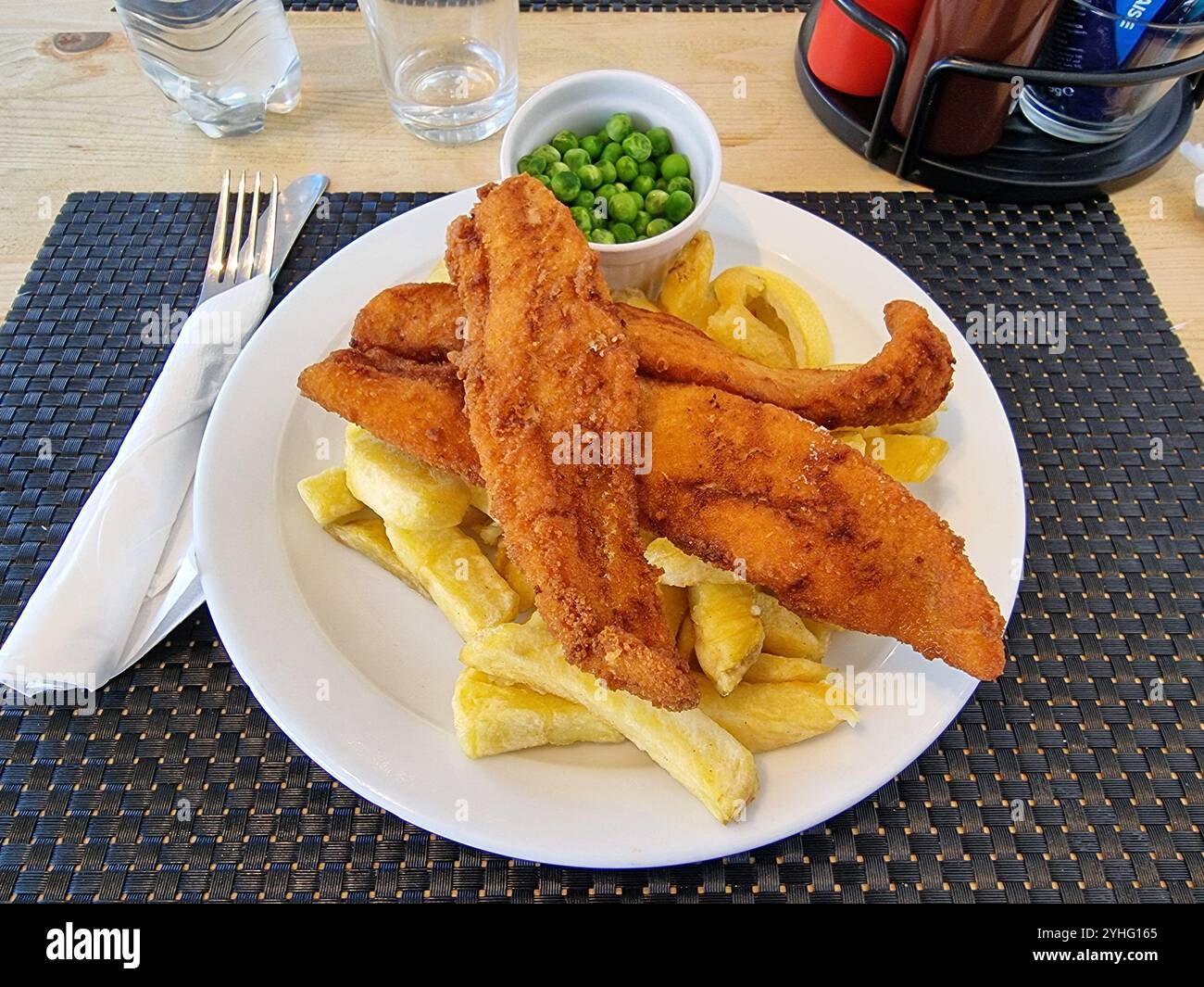 Fish and Chips with green peas Stock Photo - Alamy
