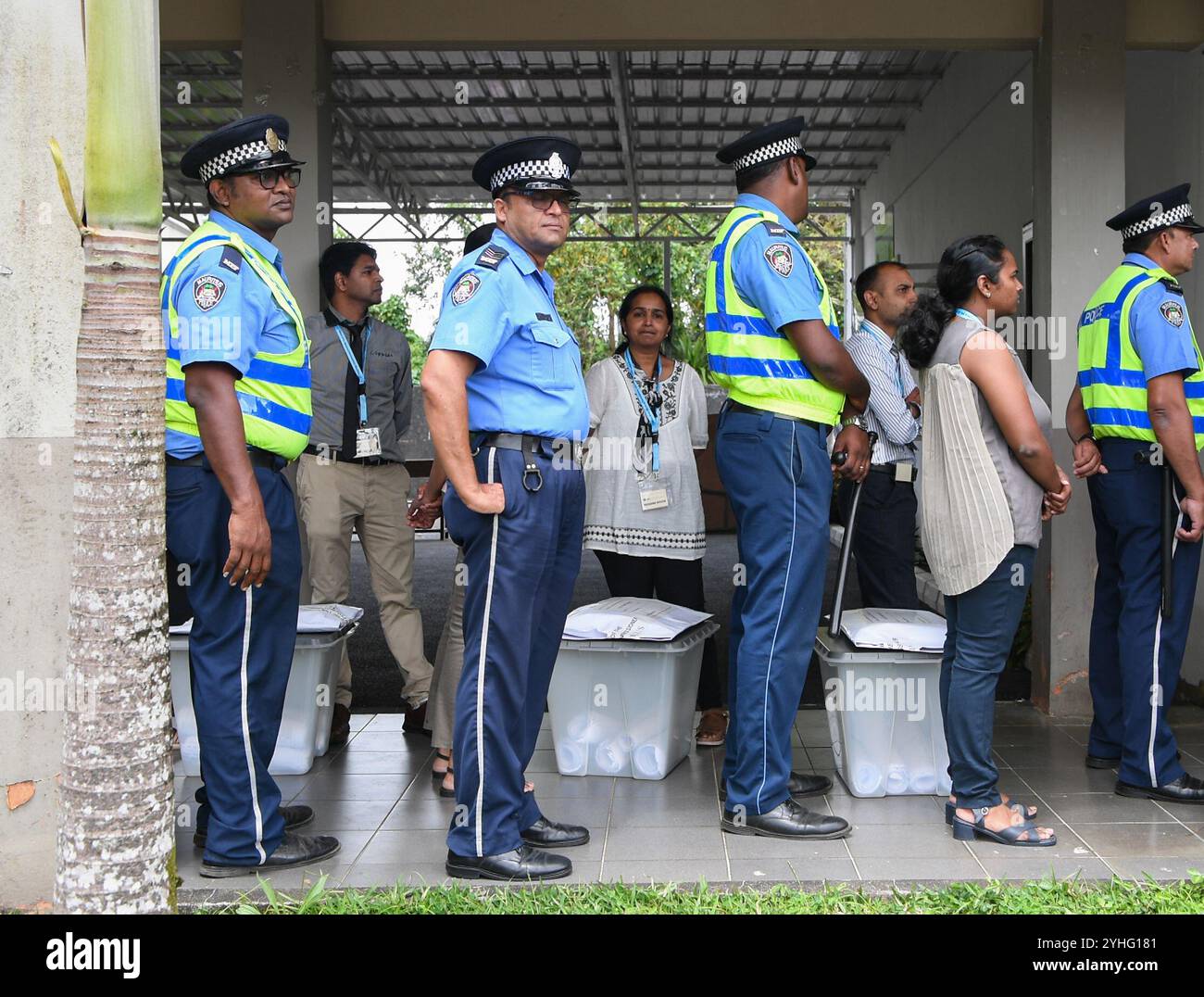 Quartier Militaire, Mauritius. 11th Nov, 2024. Staff members wait to ...