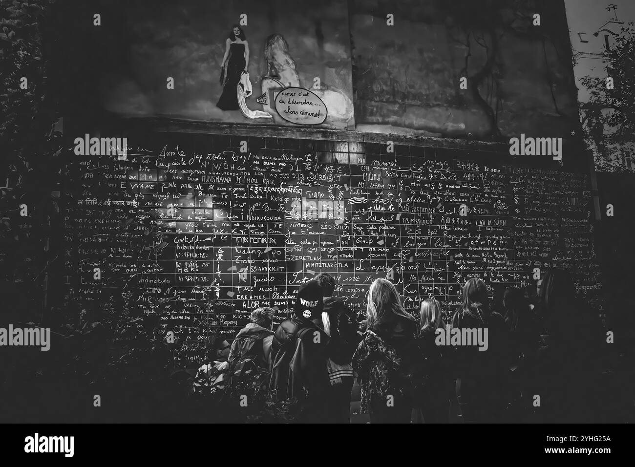 Visitors admire a wall covered in multilingual declarations of love ...