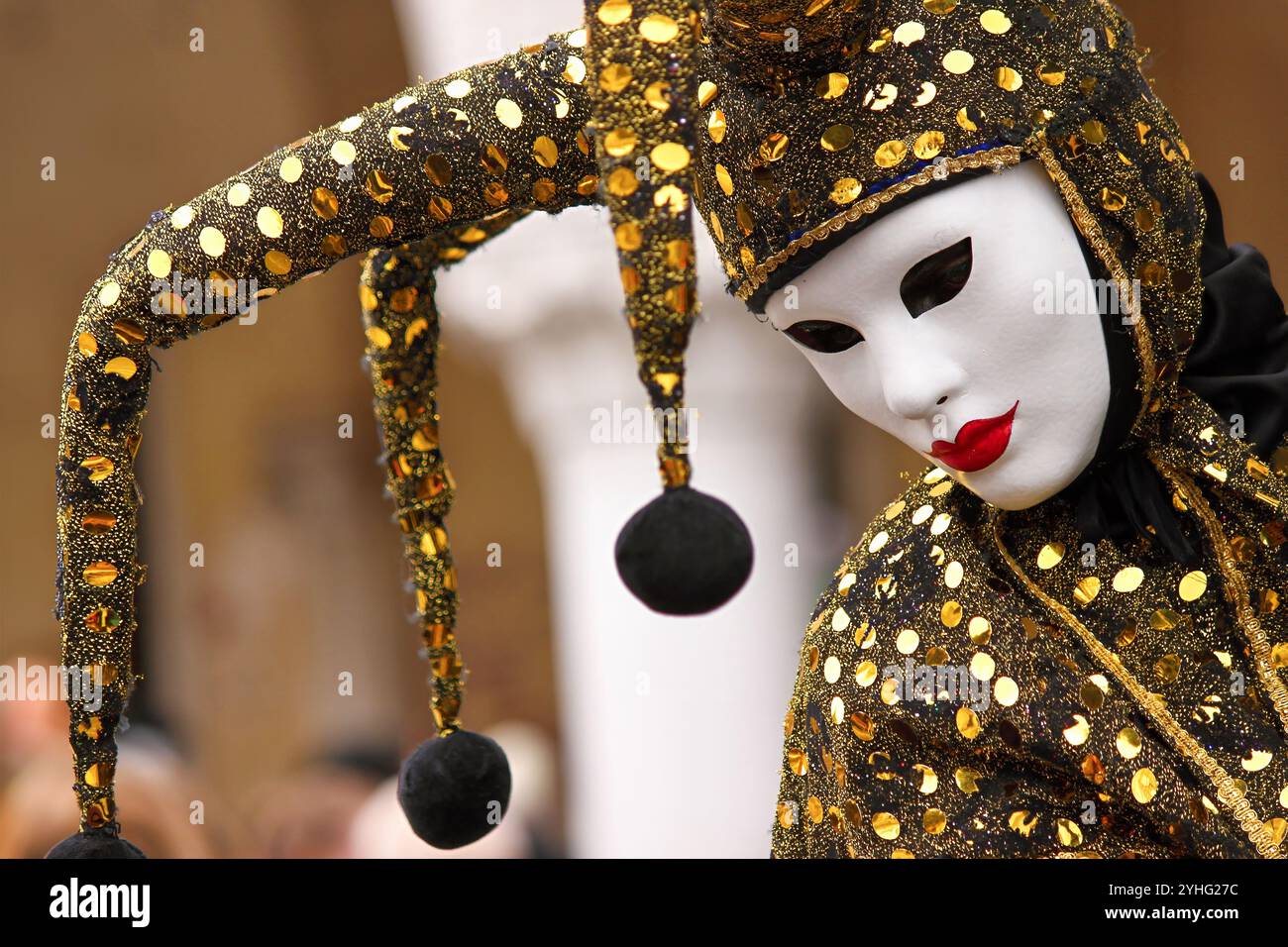 A close-up of a masked performer at the Venetian Carnival, wearing a ...