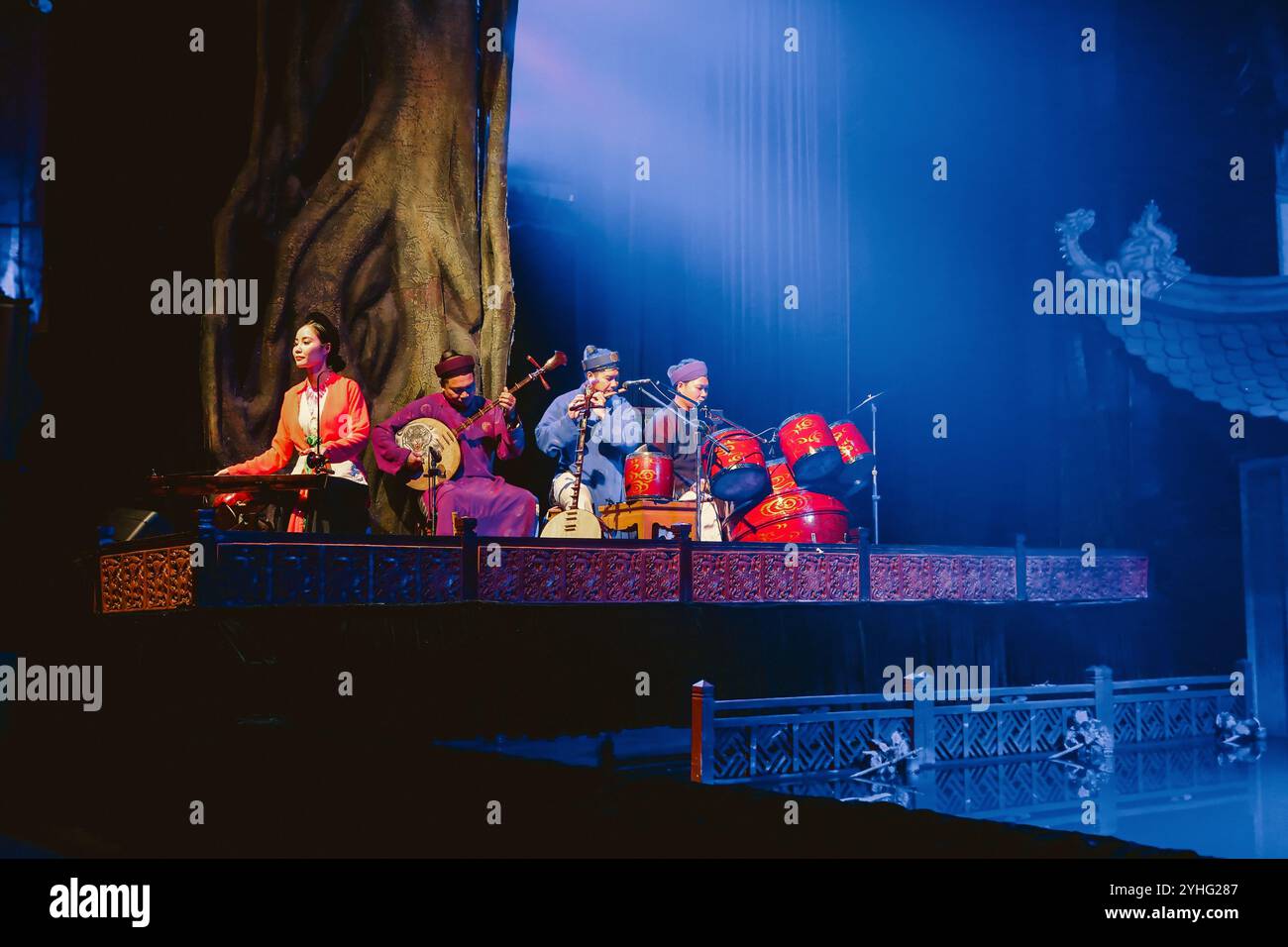 A traditional Vietnamese music performance on stage, featuring ...
