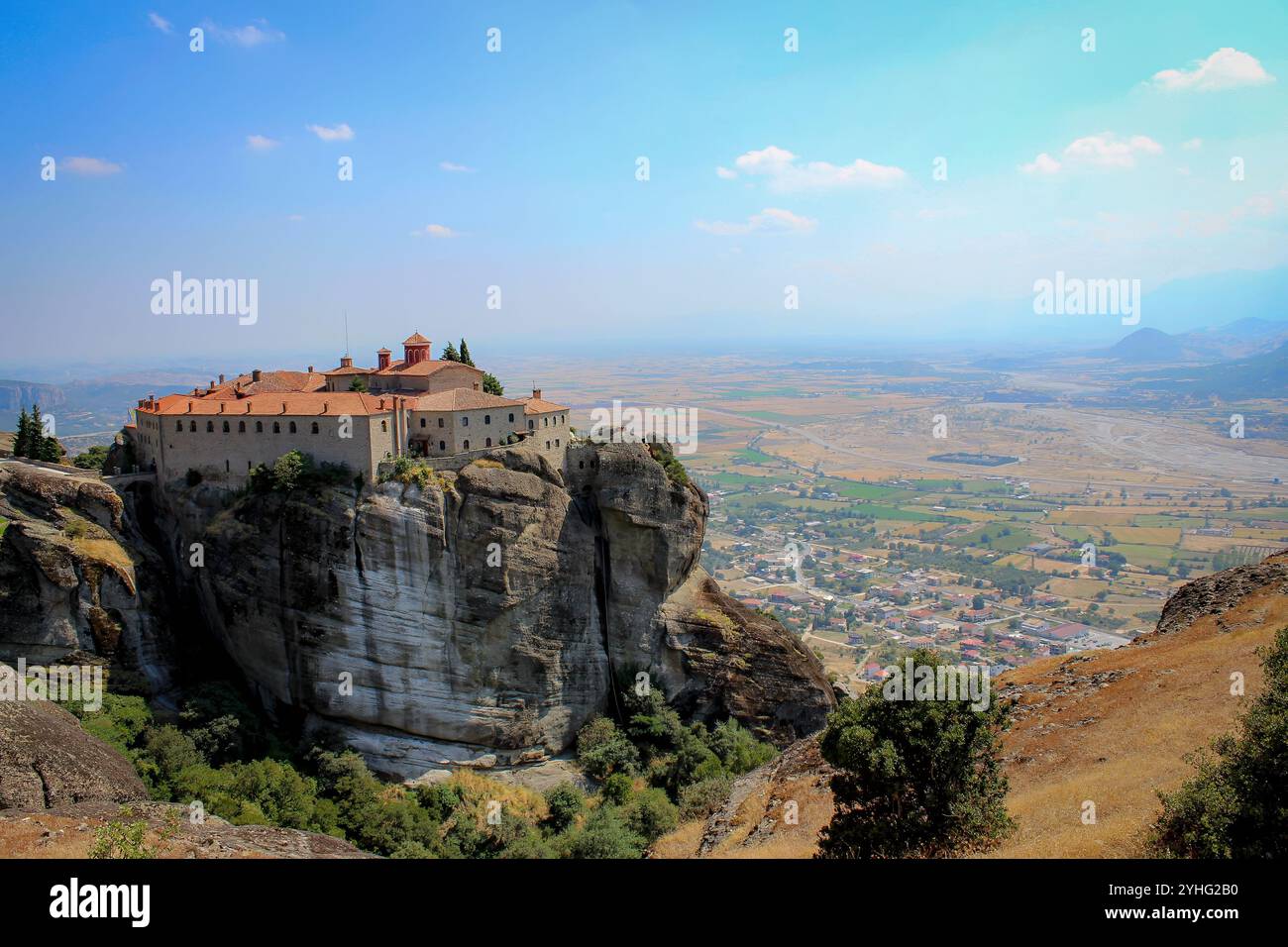 The Holy Monastery of Rousanou in Meteora, Greece, perched dramatically ...