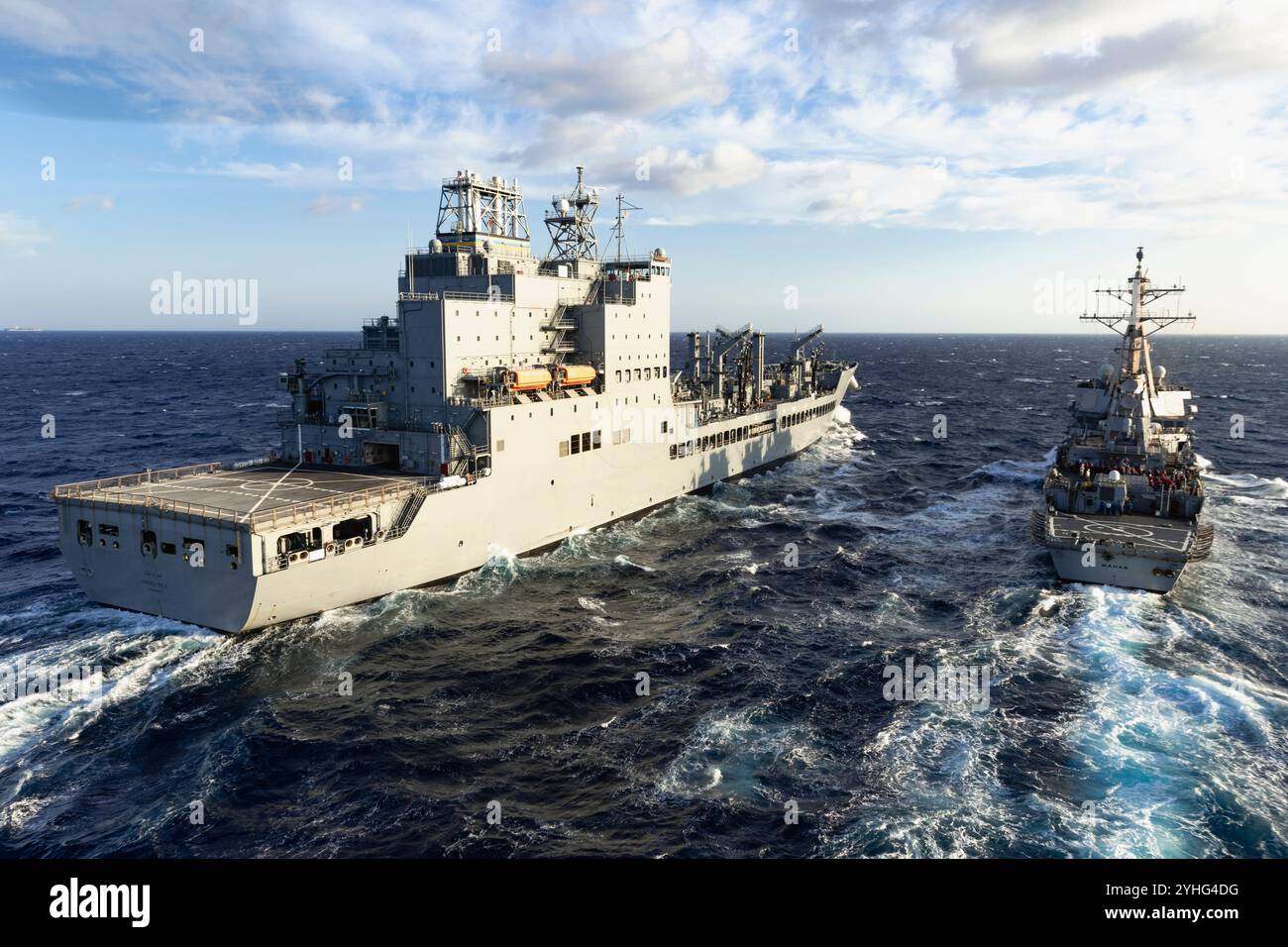 The Arleigh Burke-class guided missile destroyer USS Mahan, right ...