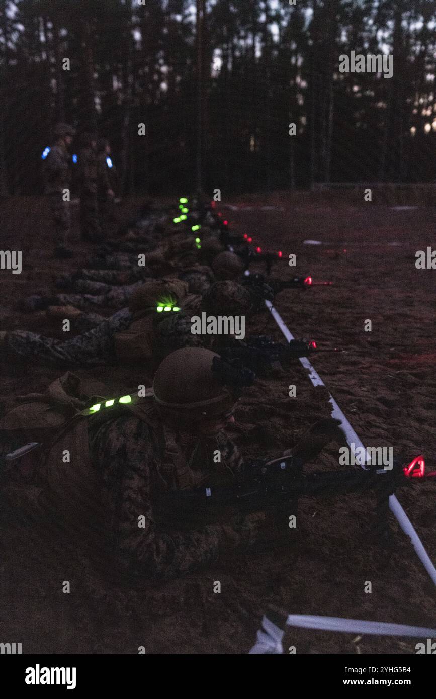 U.S. Marines conduct a low light live fire range in preparation for ...