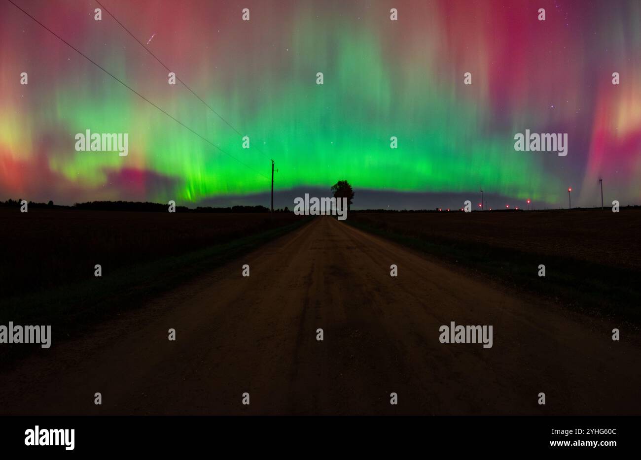 Aurora borealis over road hi-res stock photography and images - Alamy