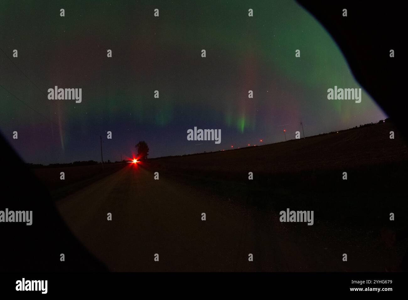 Northern lights over road hi-res stock photography and images - Alamy