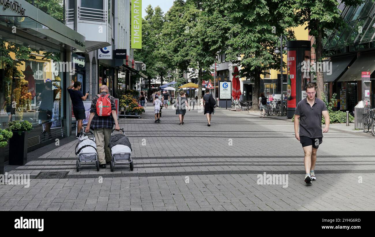Summer street scene in one of Cologne, Germany pedestrian shopping ...