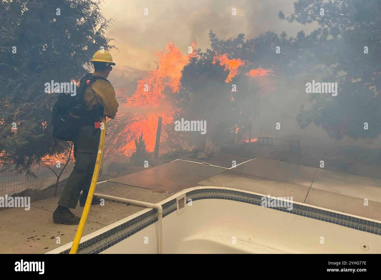 In this handout photo provided by the Reno Fire Department, fire crews ...