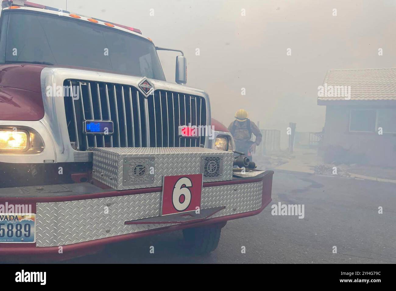 In this handout photo provided by the Reno Fire Department, fire crews ...