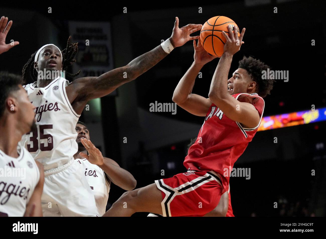 Lamar guard Alexis Marmolejos, right, looks to shoot past Texas A&M ...