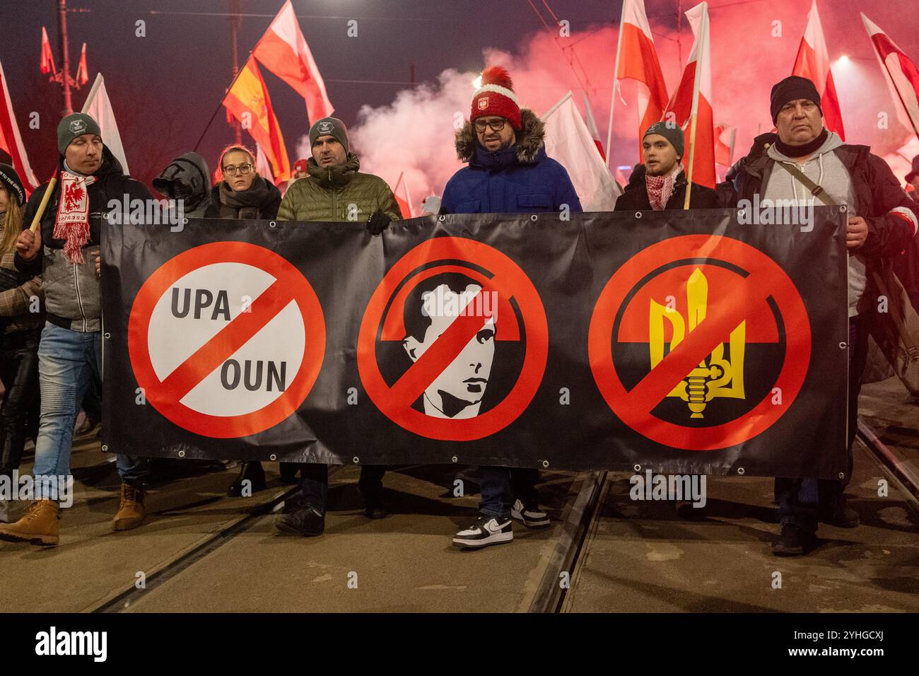 Men carry an anti-Ukrainian banner with the crossed-out name of UPA and ...